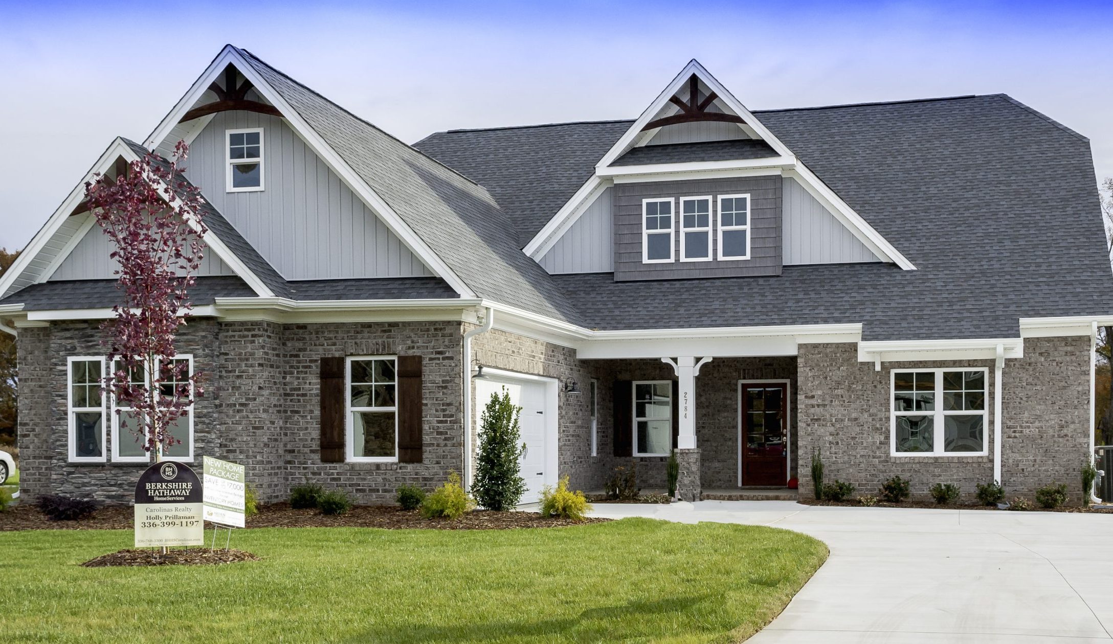 Grey house with brick store